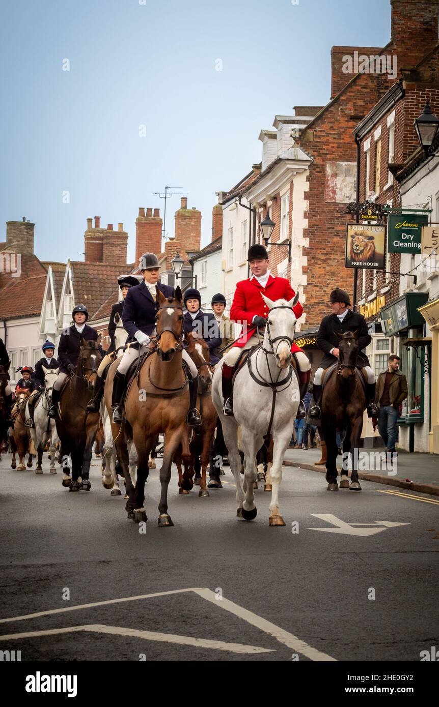 Traditional dressed members of the Middleton Hunt riding through Malton ...