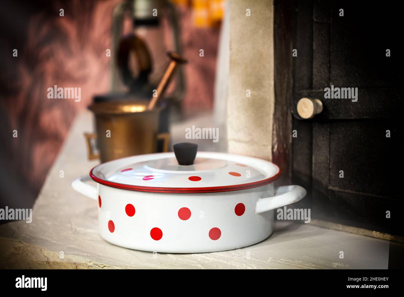 Vintage white cooking pot with red dots Stock Photo - Alamy
