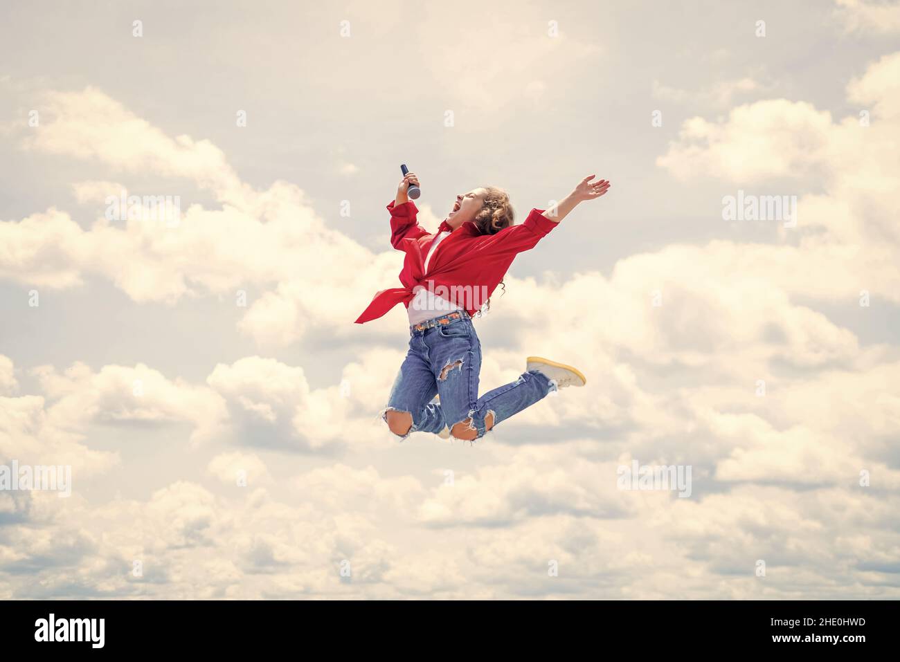 cheerful child fly high in the sky, full of energy Stock Photo - Alamy