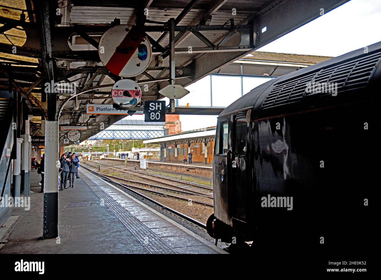 A Class 47 diesel locomotive draws up to the banner repeater signal at ...