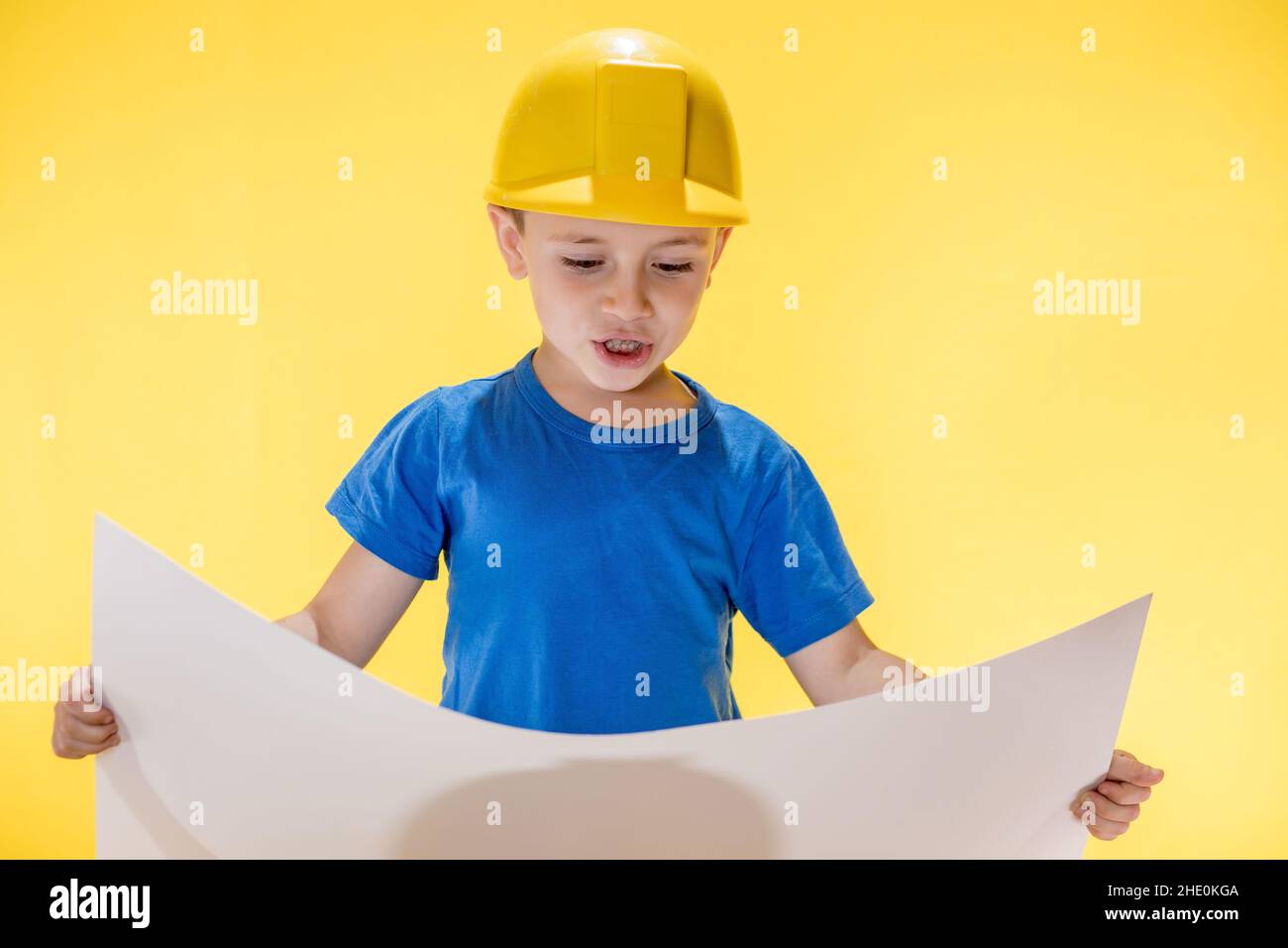 A little boy holding plan project in his hands dreams of becoming a ...