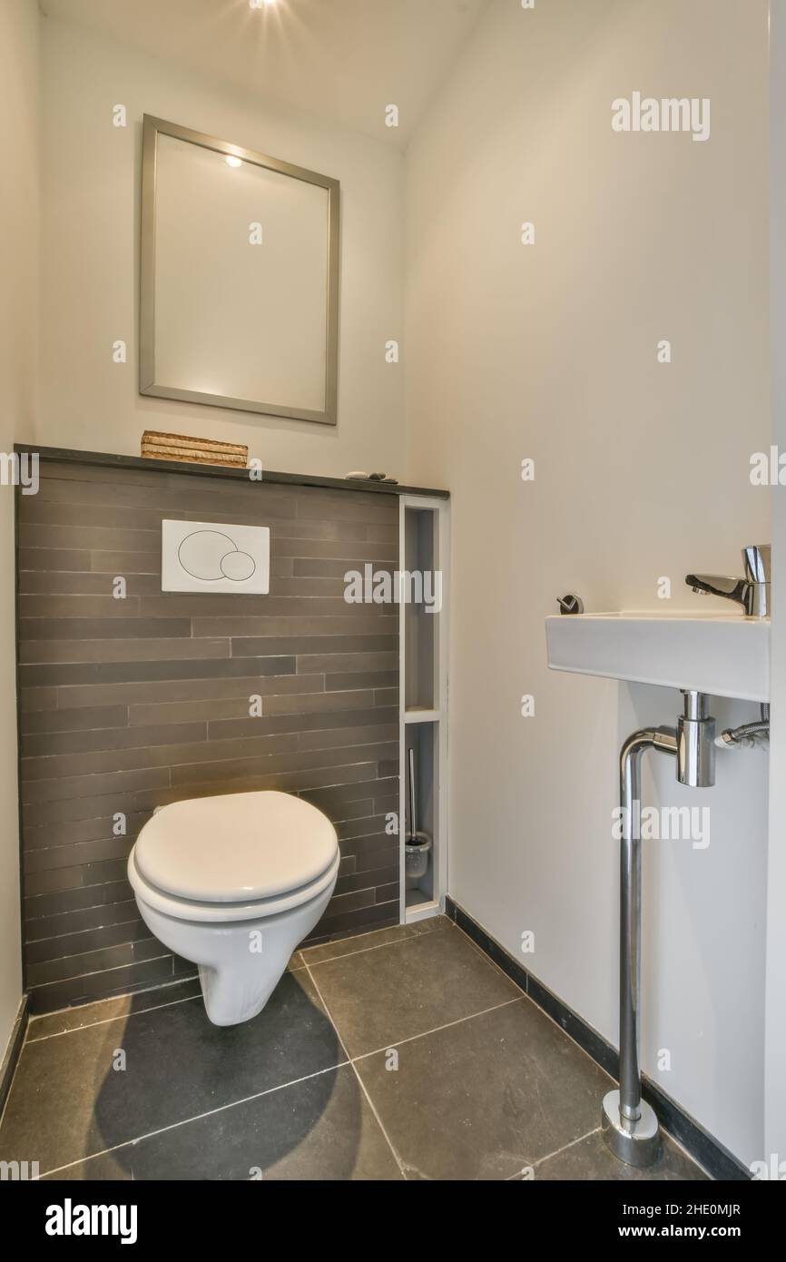 Interior of small clean restroom in miniature style Stock Photo - Alamy