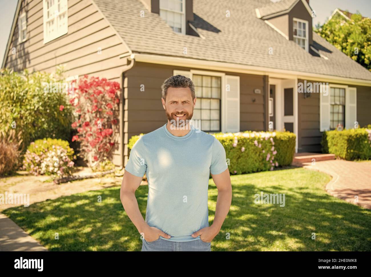 happy mature man standing outdoor at house, owner Stock Photo - Alamy