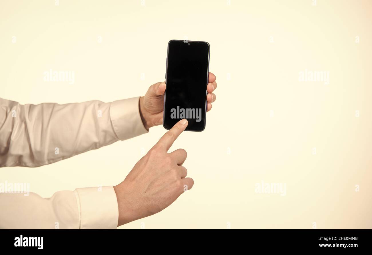 hand of man presenting phone screen. pointing finger on smartphone ...