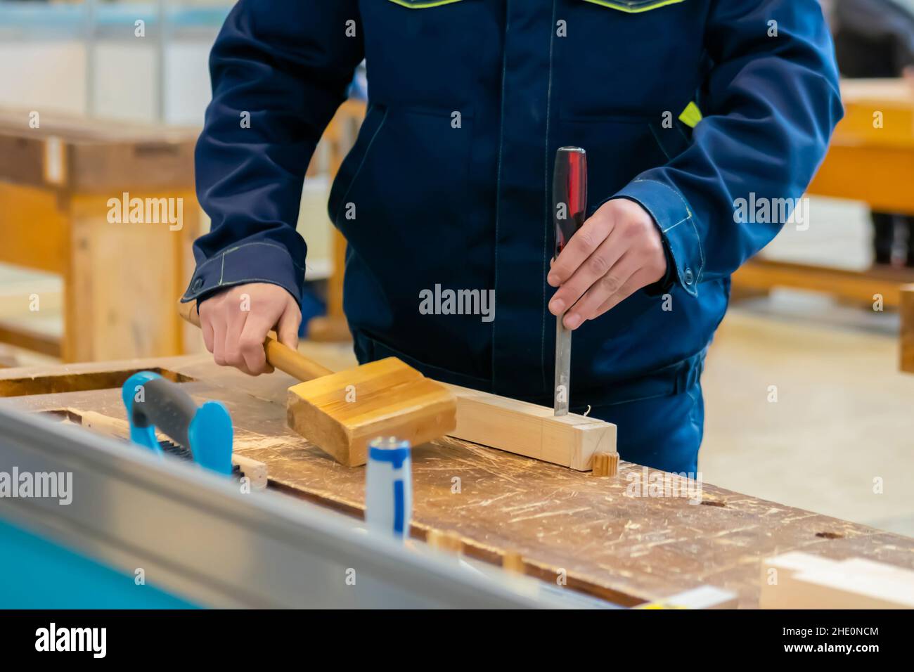 Carpenter using chisel and hammer to carve wood - close up Stock Photo ...