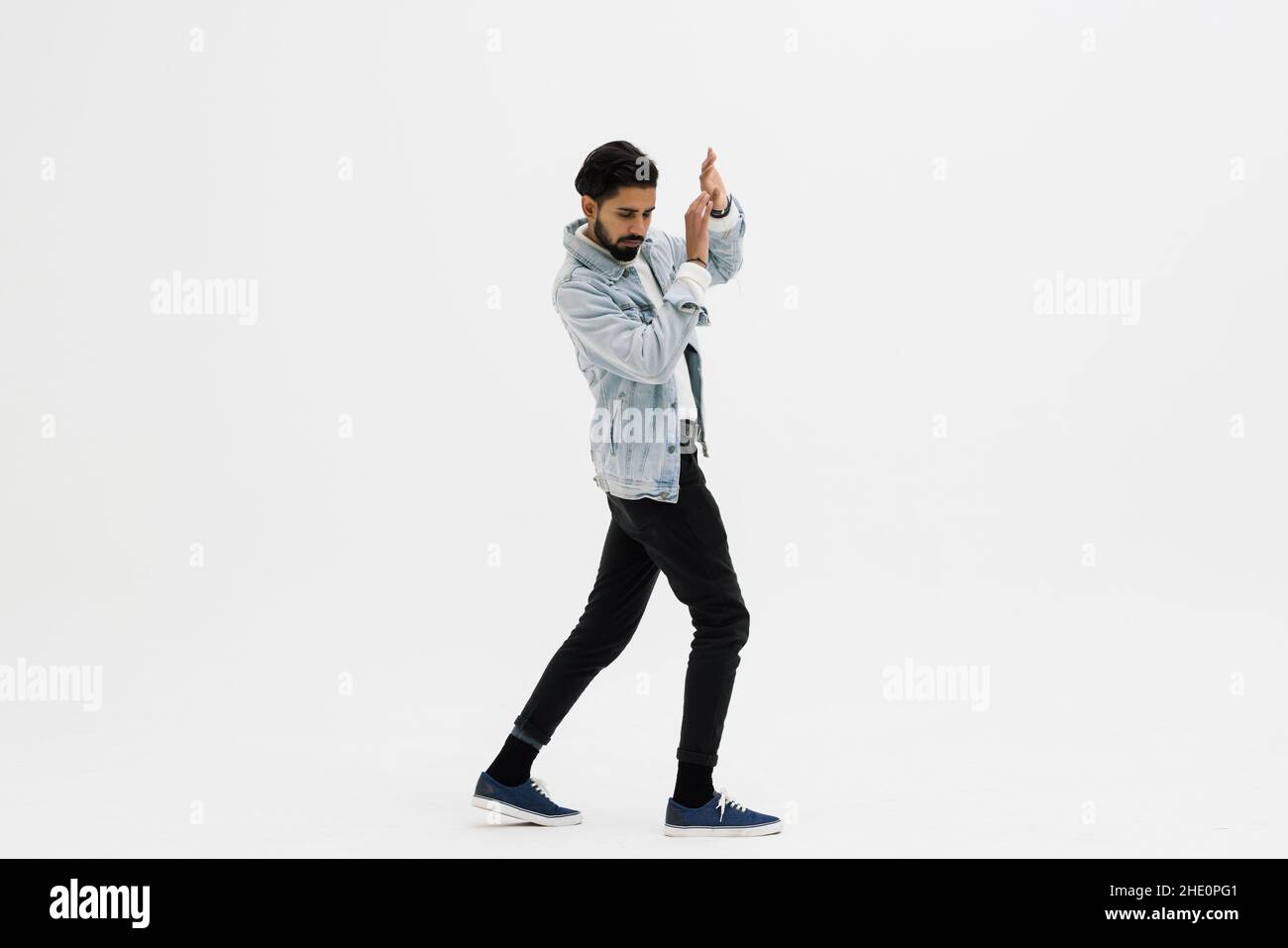 Young man standing scared over white studio background Stock Photo - Alamy