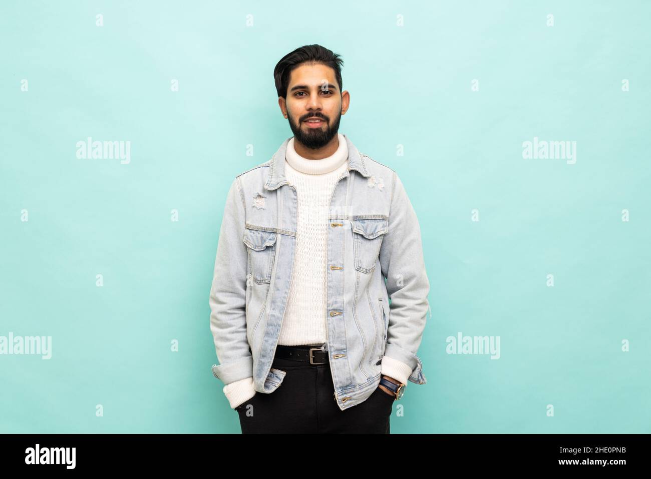 Indian business man standing against wall hi-res stock photography and ...