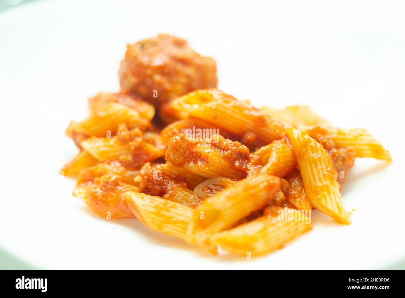 italian ragu pasta on plate close up on white background Stock Photo ...
