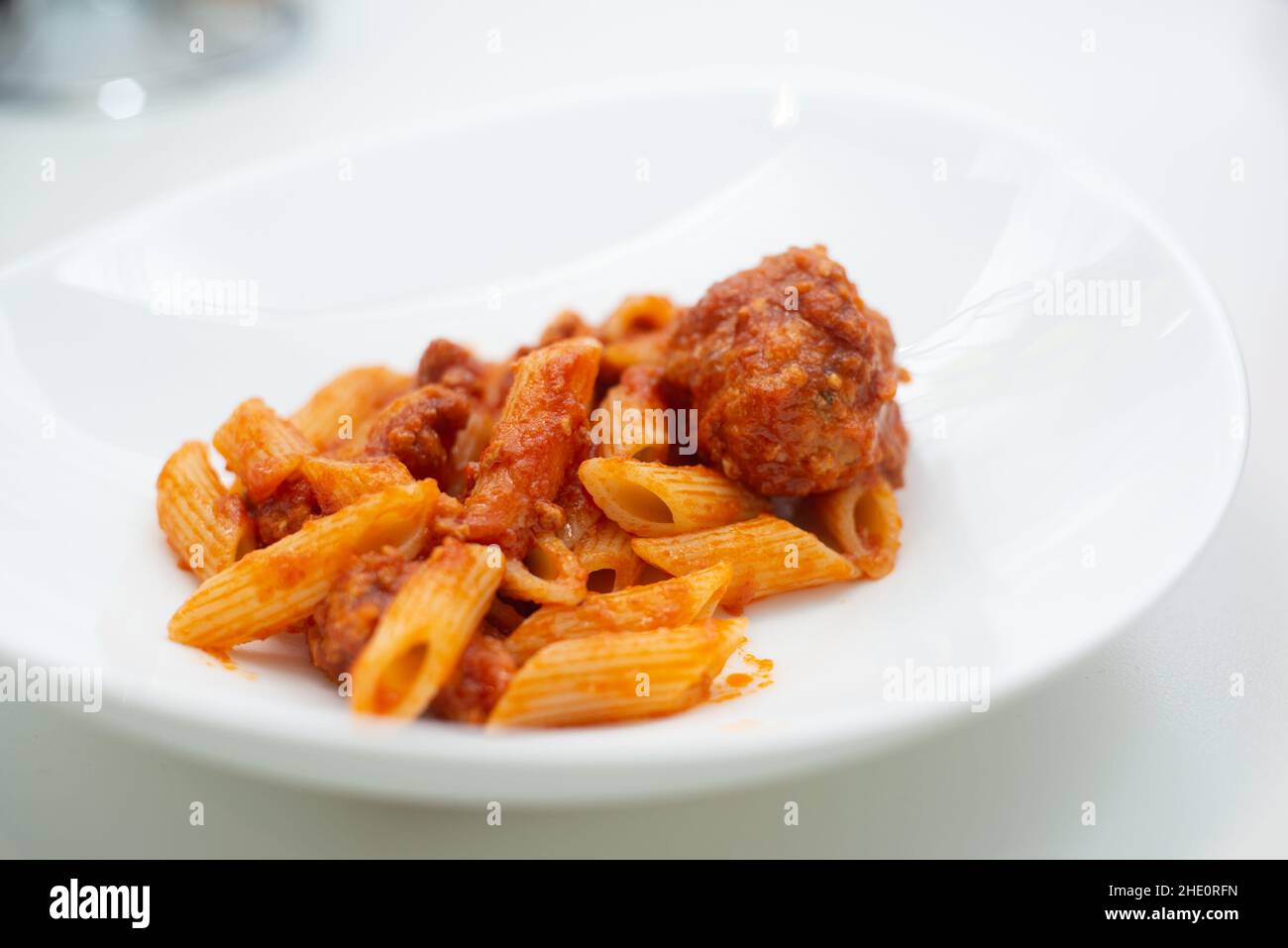 italian ragu pasta on plate close up on white background Stock Photo ...