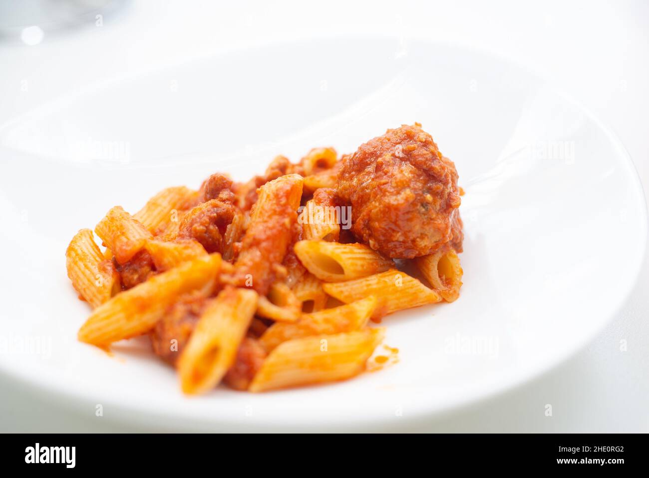 italian ragu pasta on plate close up on white background Stock Photo ...