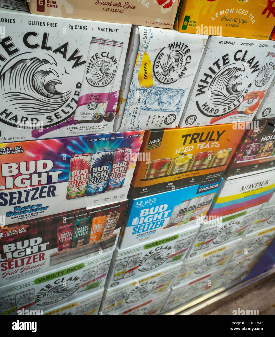 A window display of cases of White Claw and other brand hard seltzer in ...