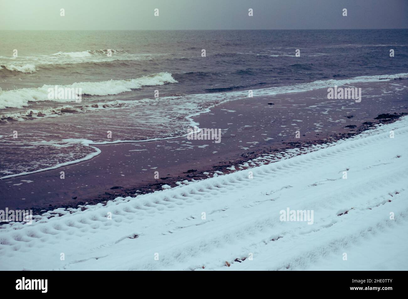 Snow on a beach - winter time Stock Photo - Alamy
