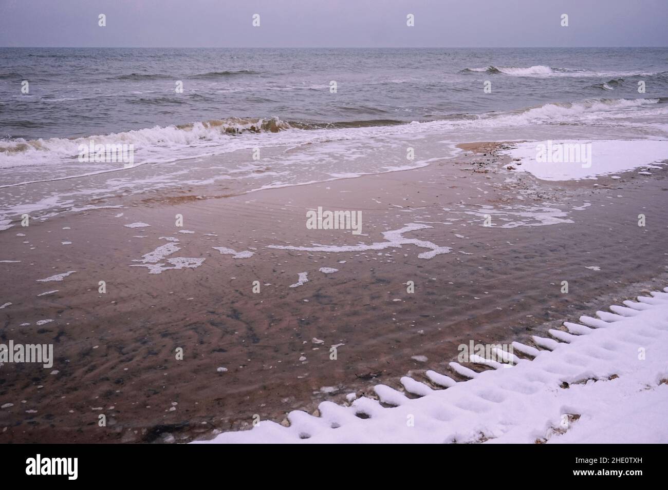 Snow on a beach - winter time Stock Photo - Alamy