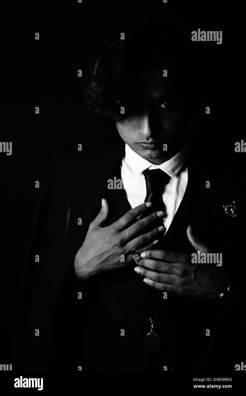 Grayscale portrait of an Indian gentleman in a classic outfit ...