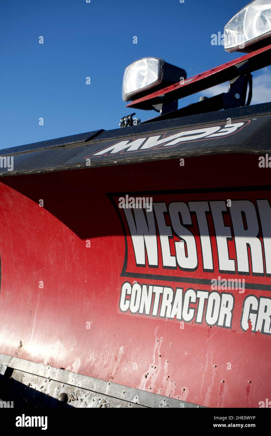Vertical of a snow plow blade with writing "Western contractor grade ...
