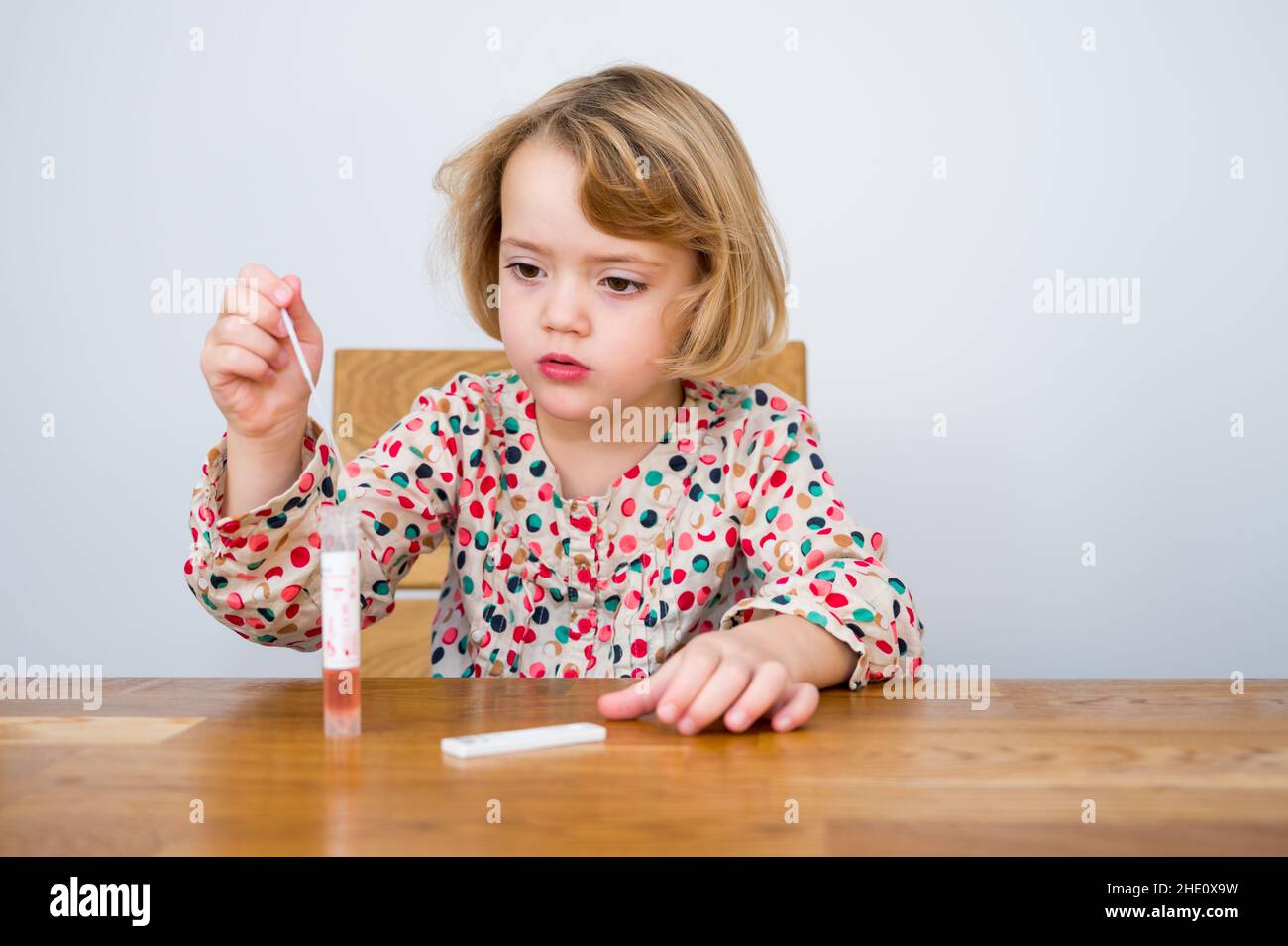 Cute blonde girl self testing for corona virus and waiting for results ...