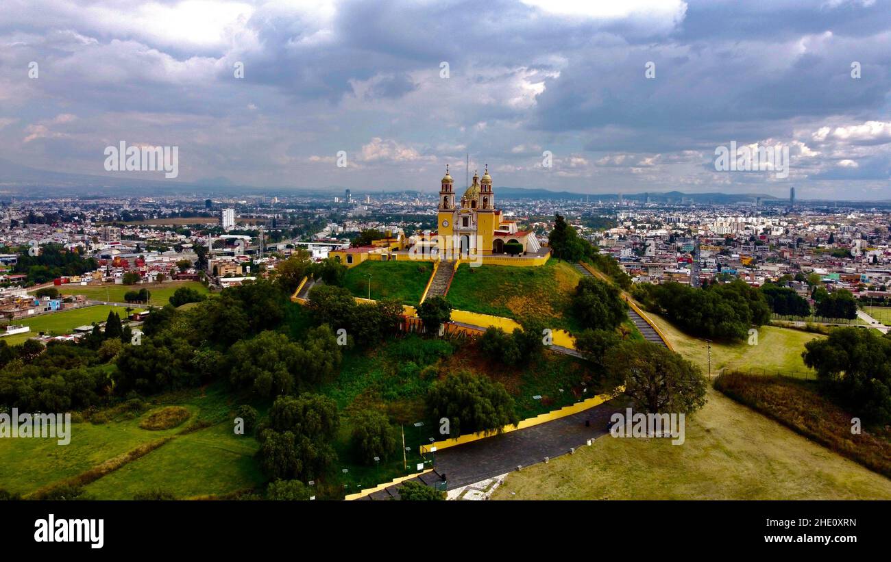 Beautiful view of the famous Puebla Cathedral surrounded by trees in ...