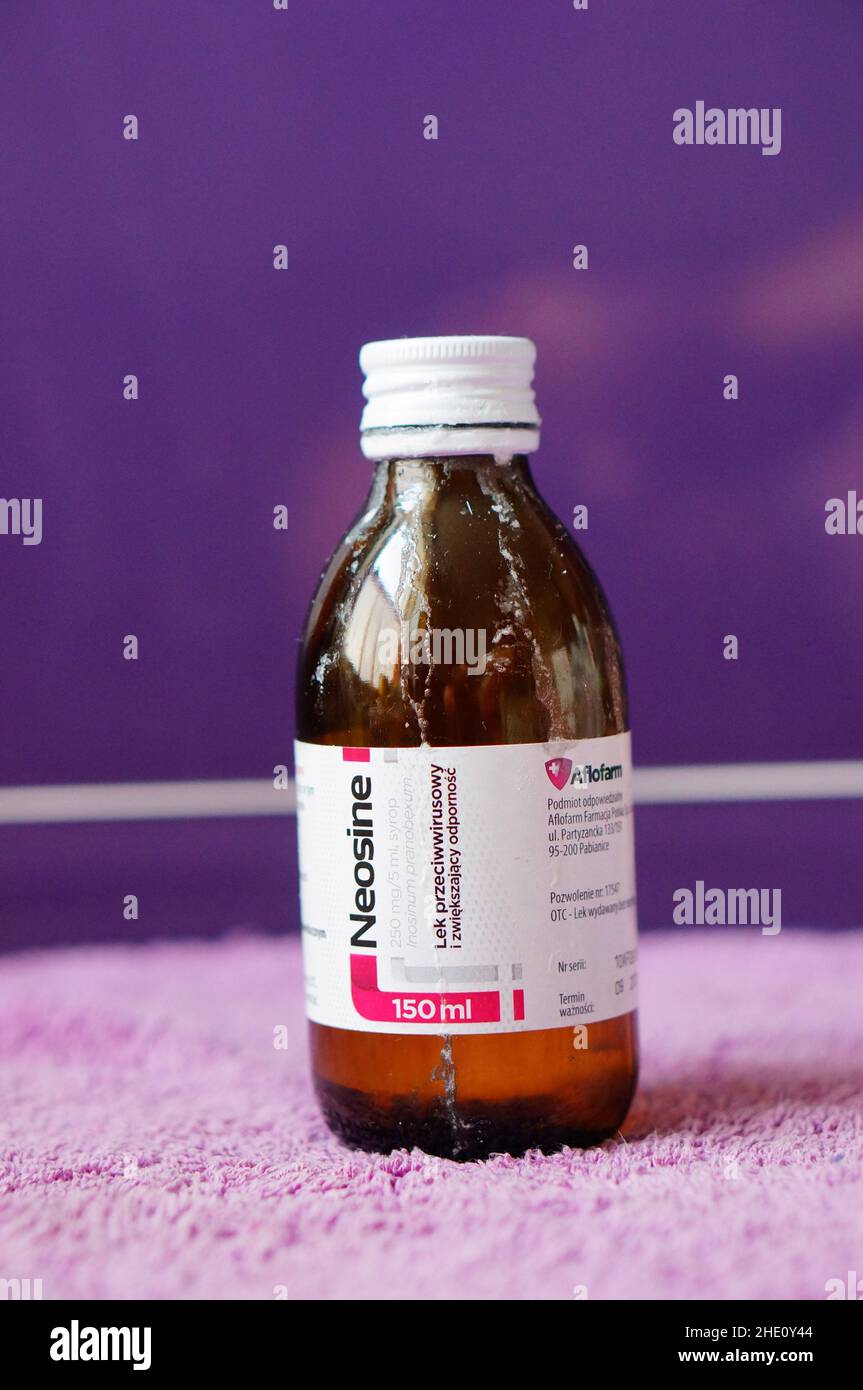 Polish Neosine brand syrup against flu and cold in an opened bottle ...