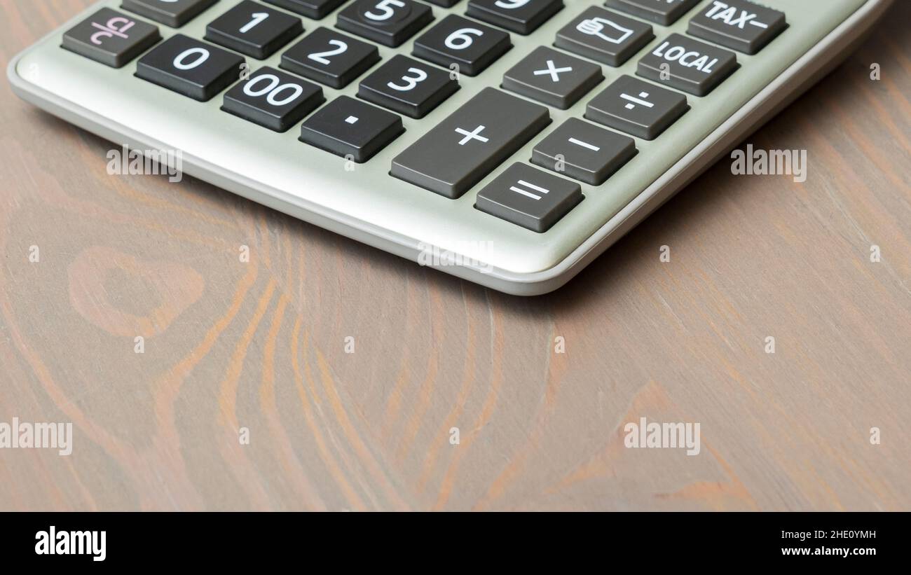 calculator on desk in office Stock Photo - Alamy