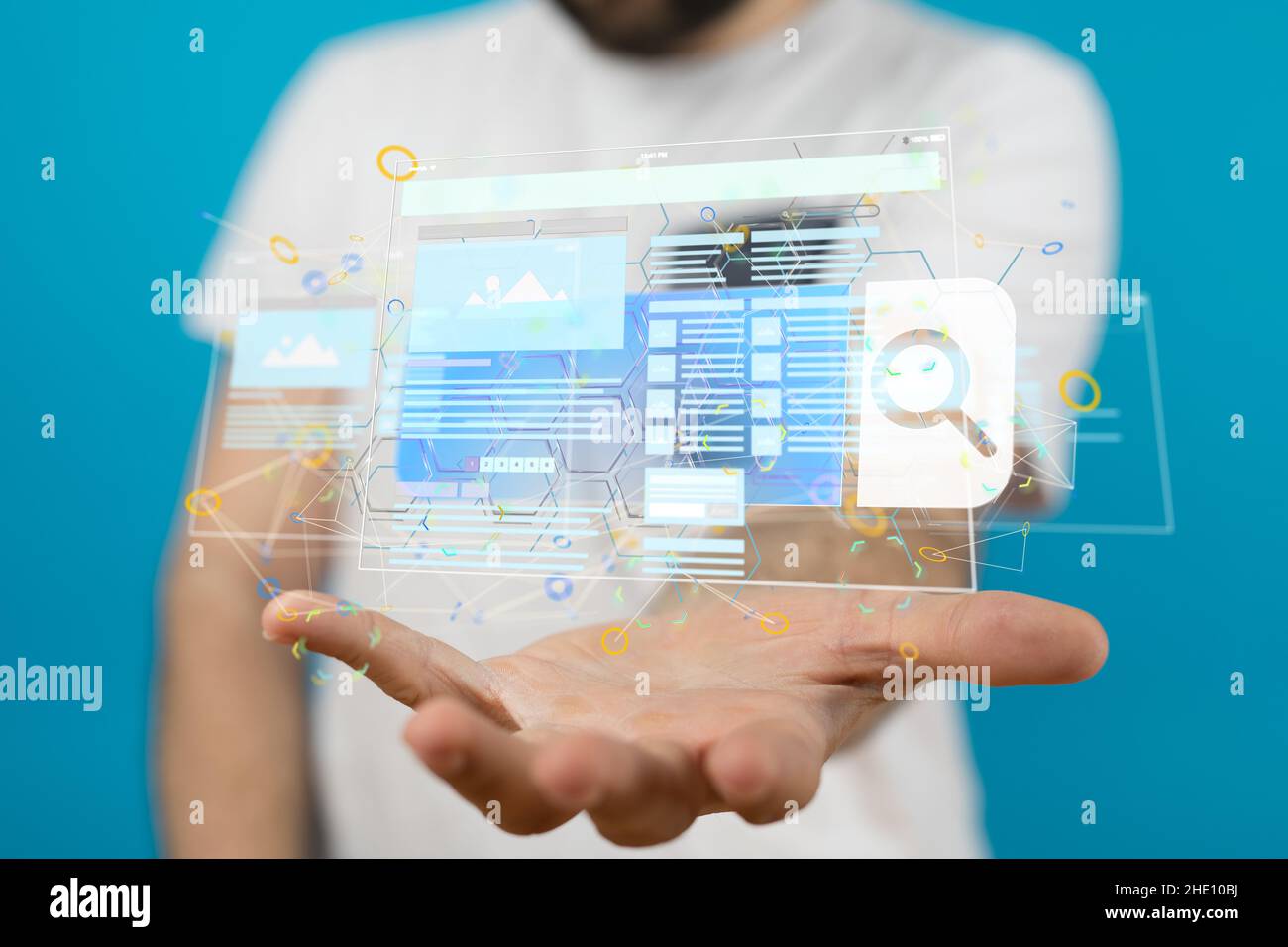 Male's hand holding an illustration of an interface web application ...