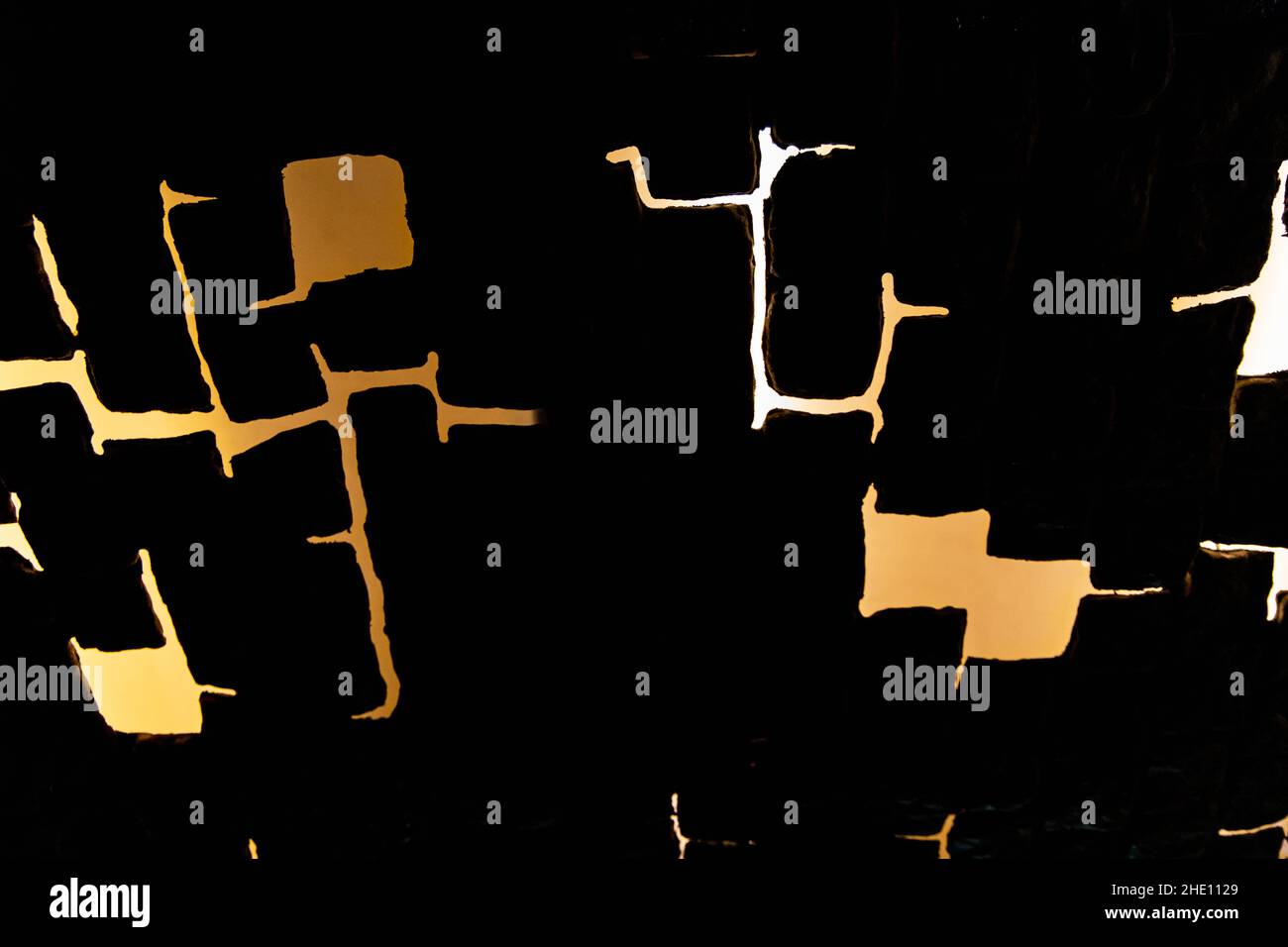 Stony ceiling with glowing colorful holes between dark shapes Stock ...