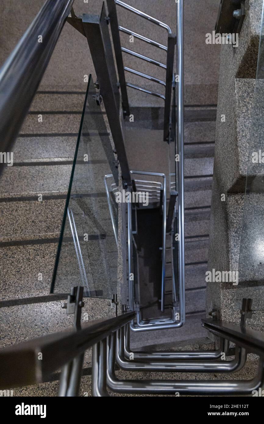 Spiral rectangle staircase with metal railings and terrazzo on the ...