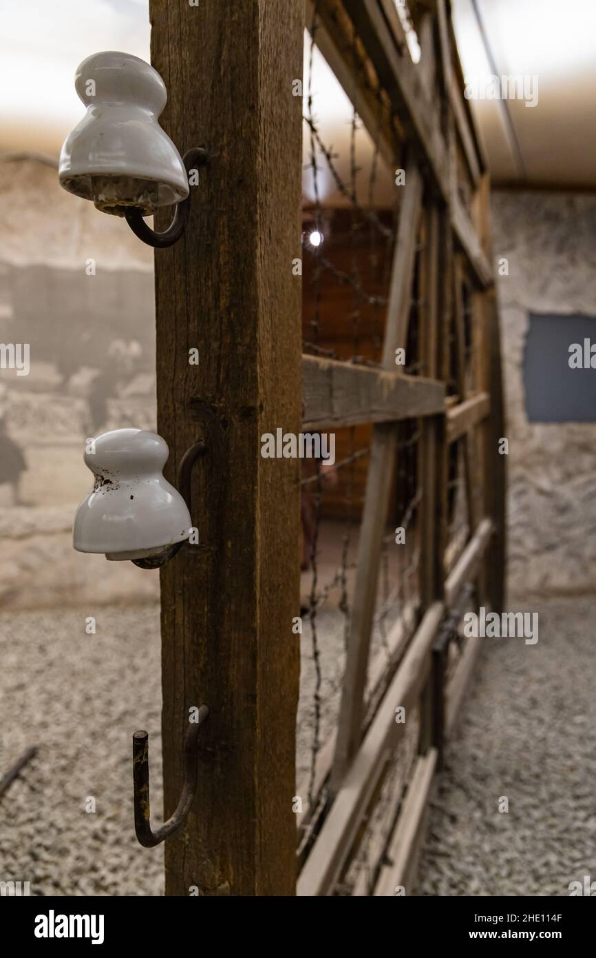 High old wooden fence full of live barbed wire Stock Photo - Alamy