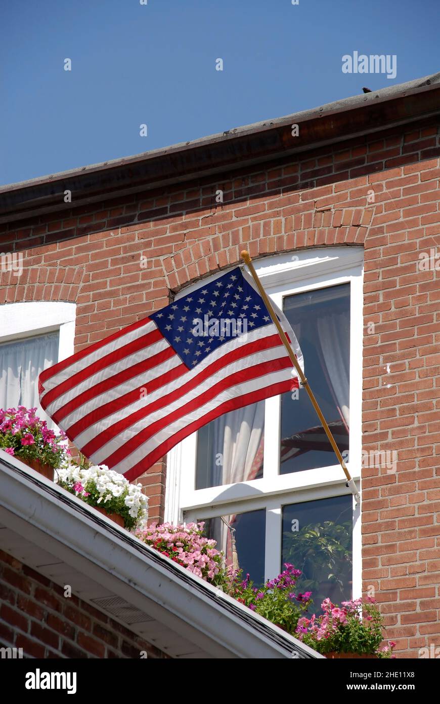 American flag in a window hi-res stock photography and images - Alamy