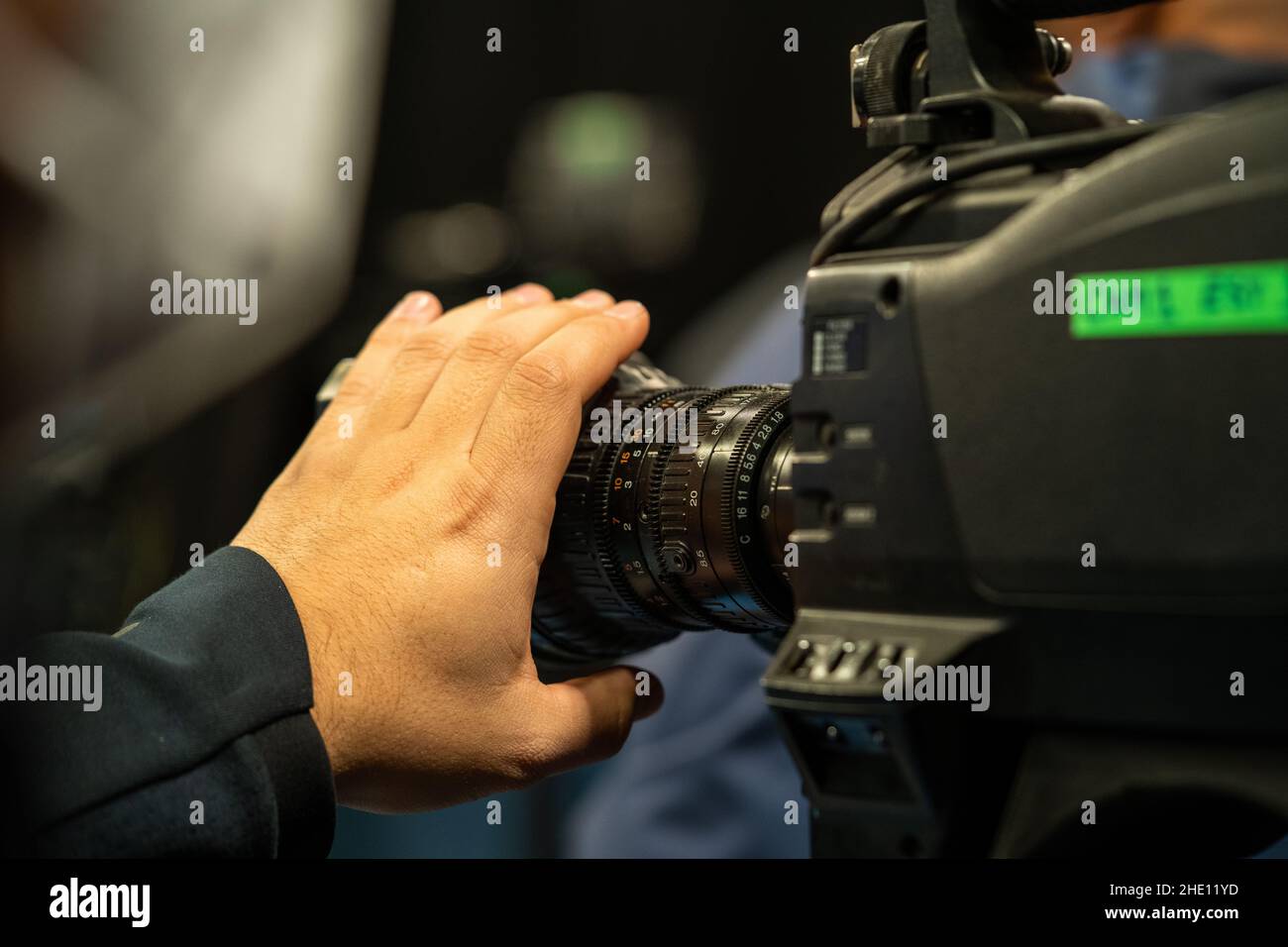 Hand correcting the focus on a broadcast tv camera Stock Photo - Alamy