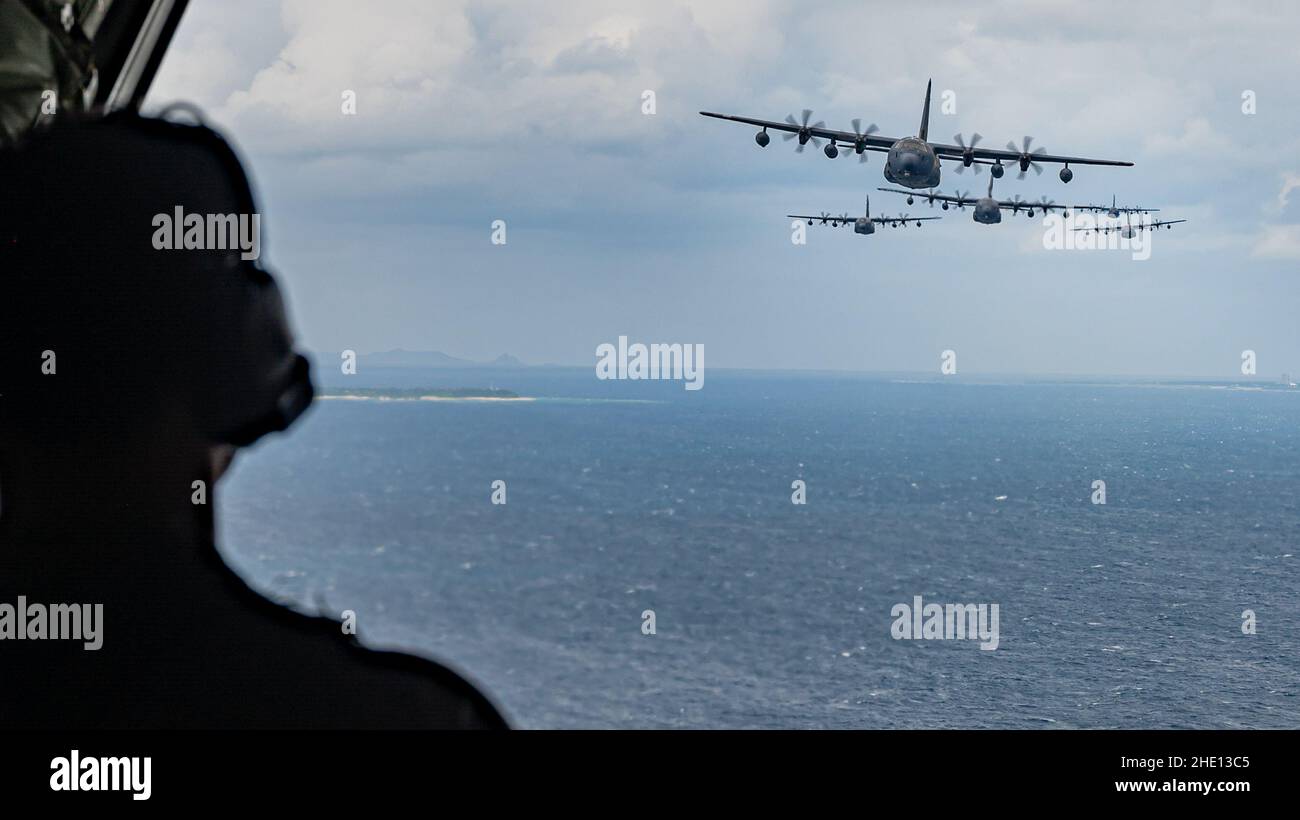 A 1st Special Operations Squadron loadmaster observes a formation of MC ...