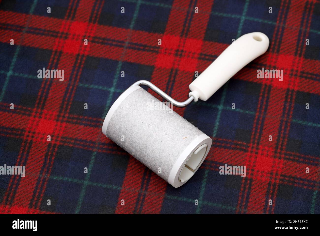 close up of used sticky roller cleaning, housework and housekeeping ...