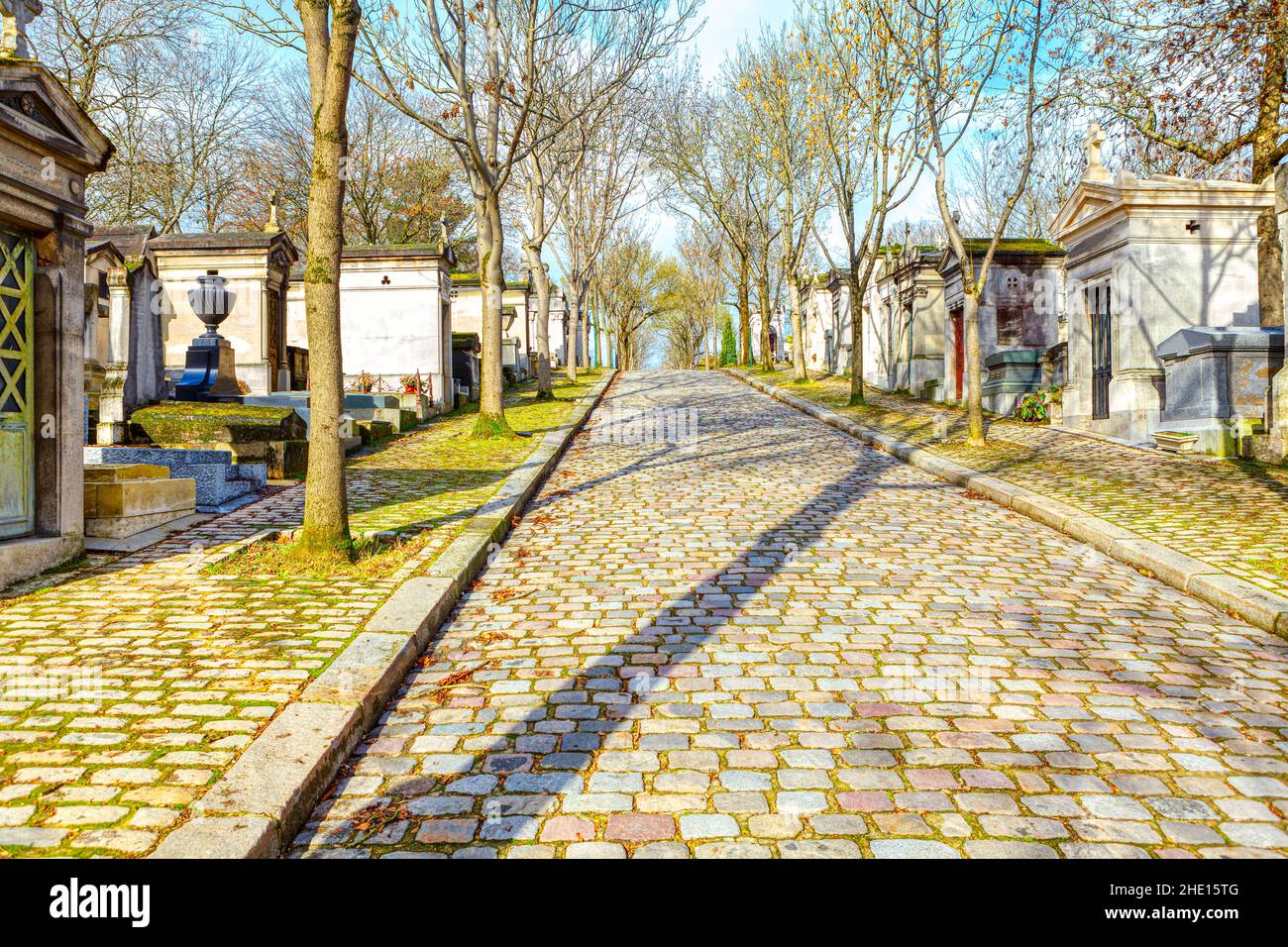 Path in cemetery . Pere Lachaise Cemetery . Pavement and crypts in the ...