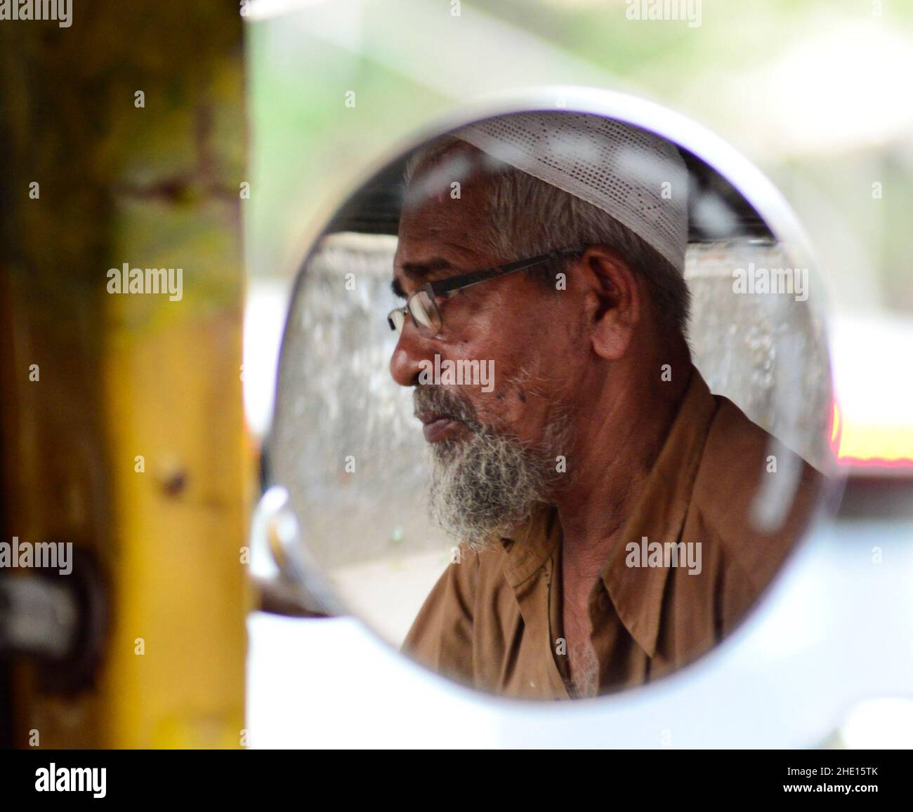 An Indian Muslim auto rickshaw driver in Mumbai, India Stock Photo - Alamy