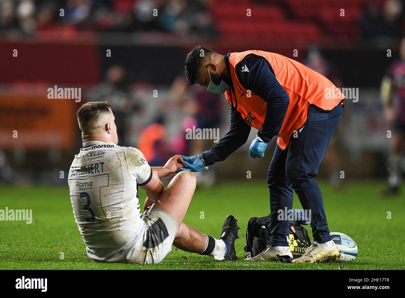 Nick Schonert of Sale Sharks, receives treatment during the game Stock ...