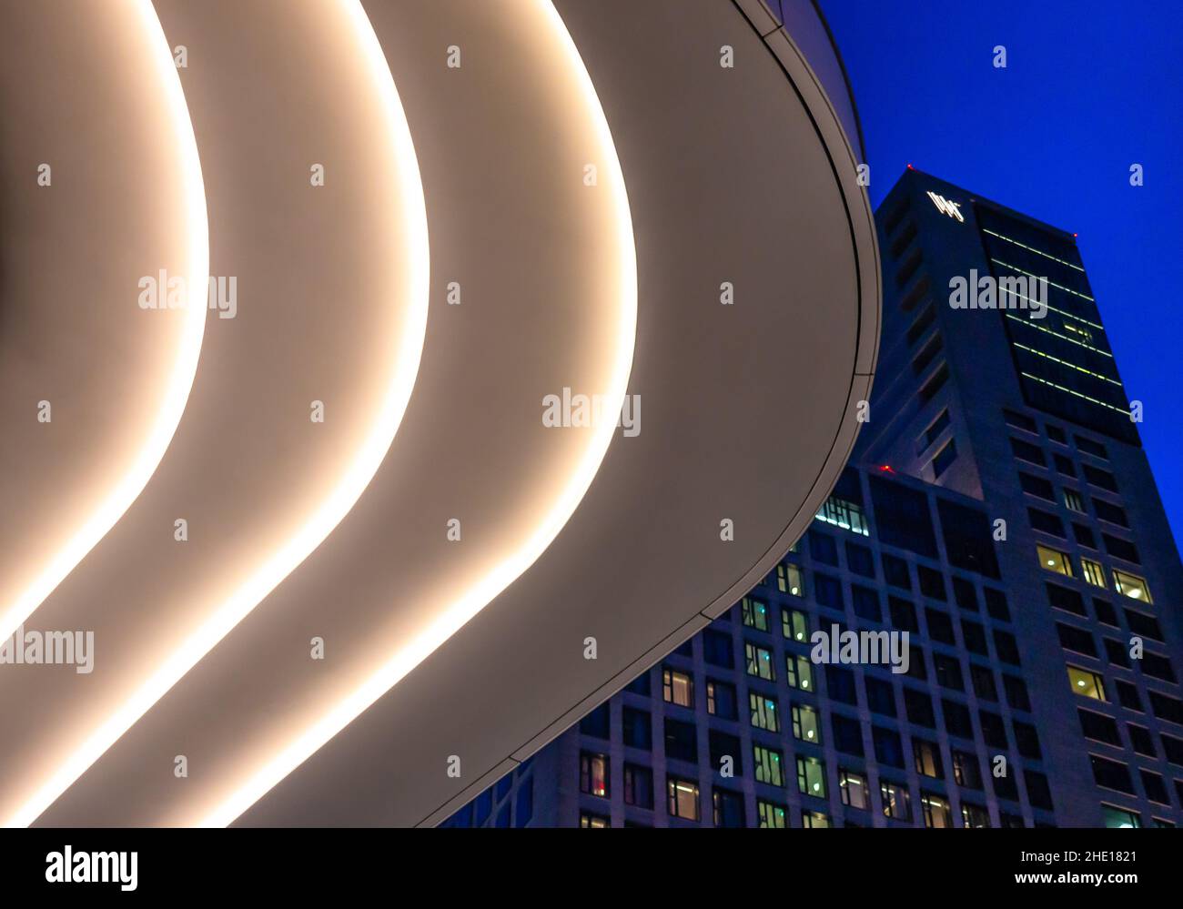 A modern shiny ceiling and a vertical modern skyscraper building ...