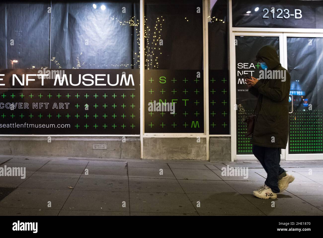 Seattle, USA. 7 Jan, 2022. A person passing Seattle’s new NFT museum in ...