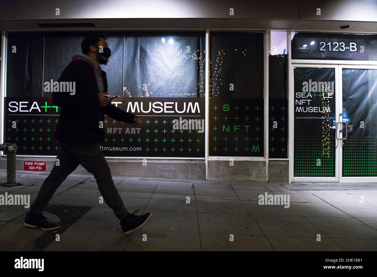 Seattle, USA. 7 Jan, 2022. A person passing Seattle’s new NFT museum in ...