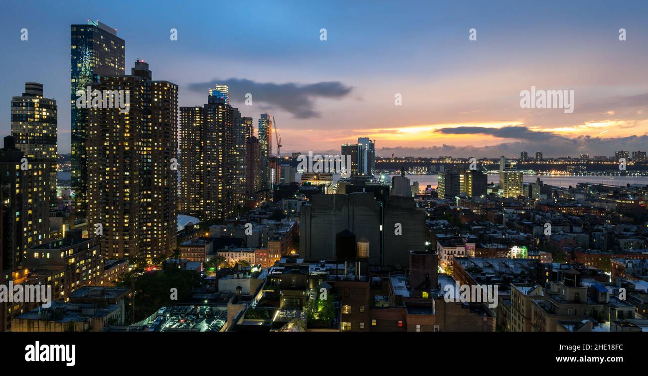 Golden sunset in a city with skyscrapers Stock Photo - Alamy