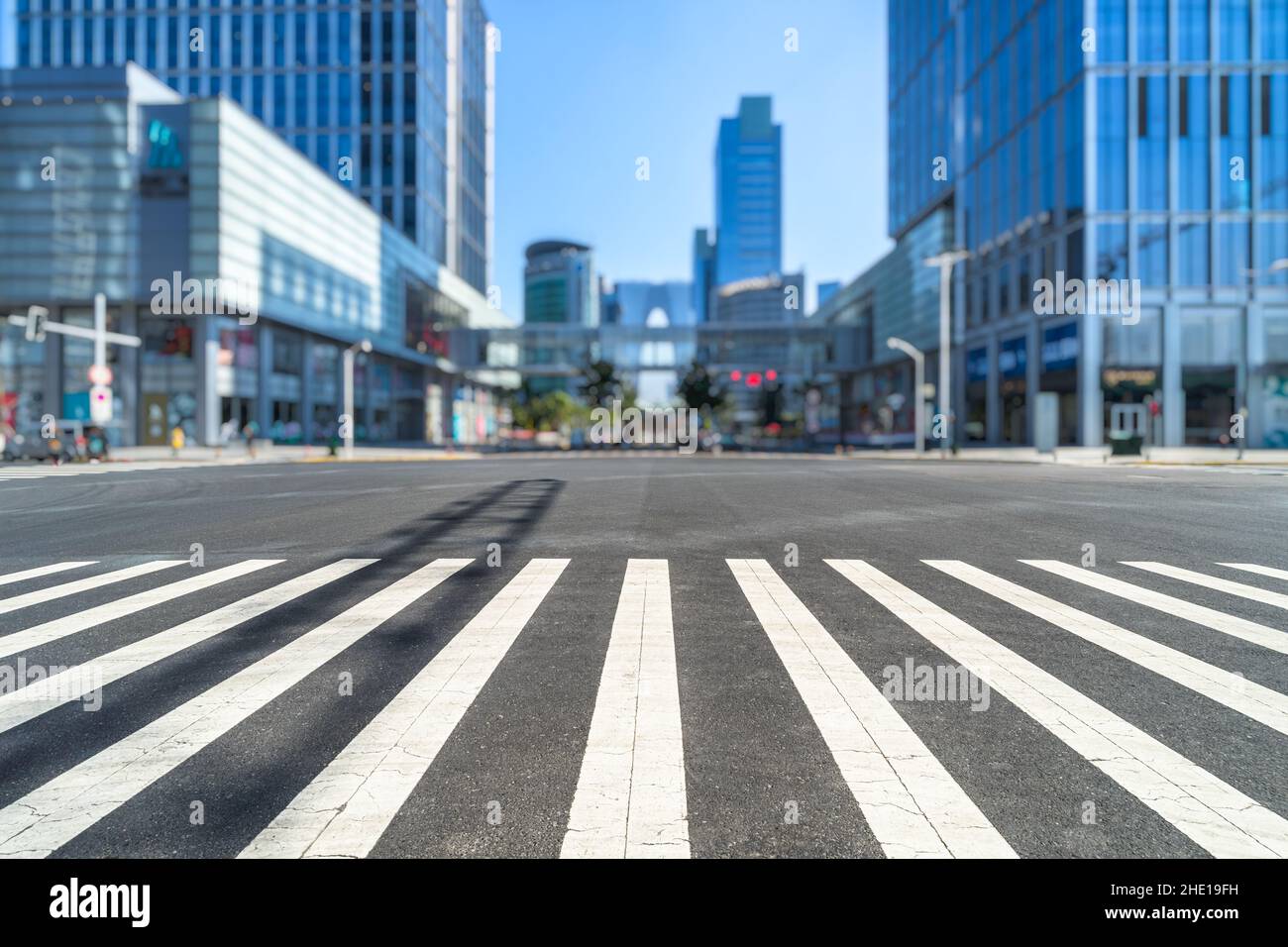 empty road with zebra crossing and skyscrapers in modern city Stock ...