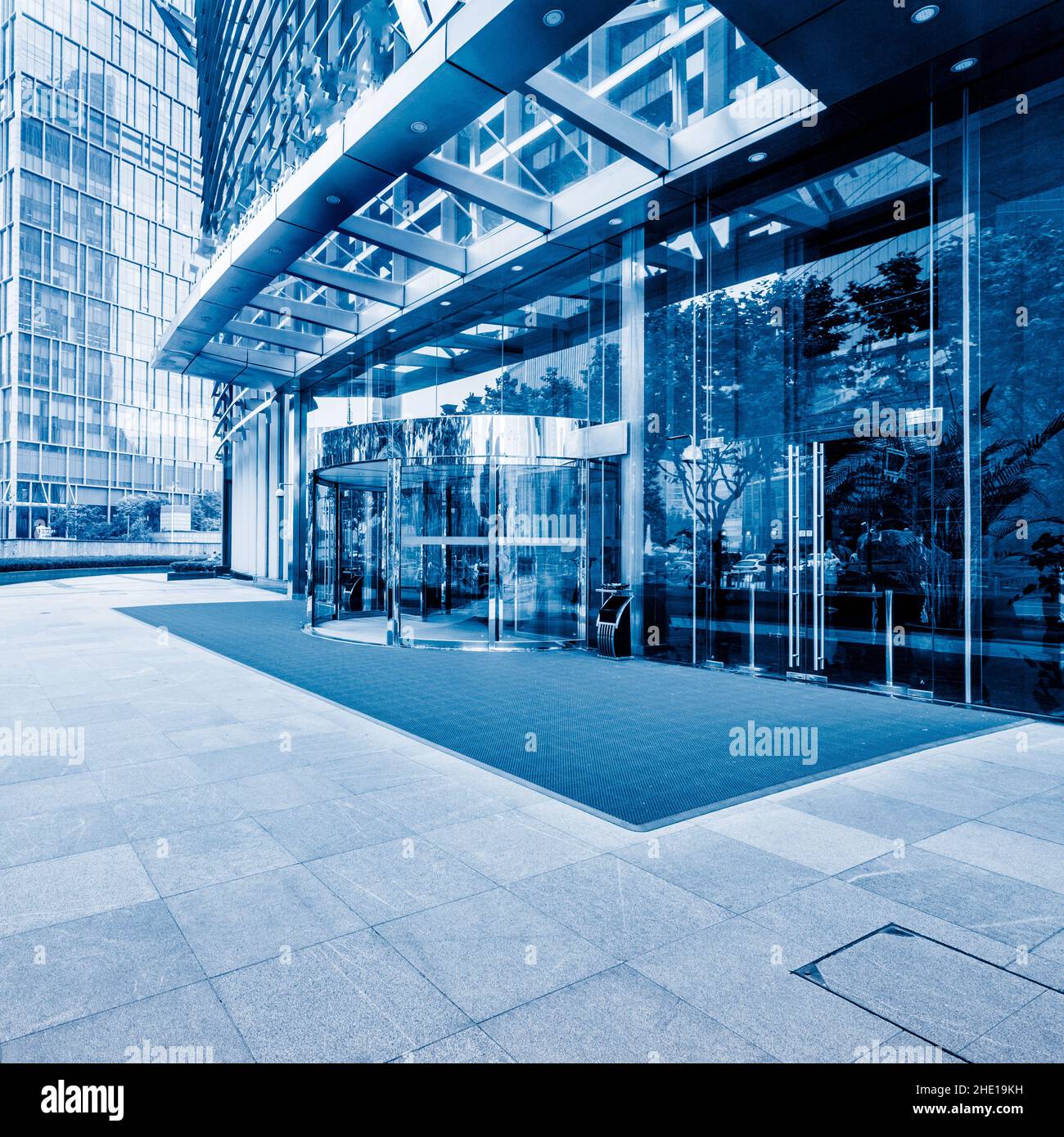 office building entrance in downtown, blue toned image Stock Photo - Alamy