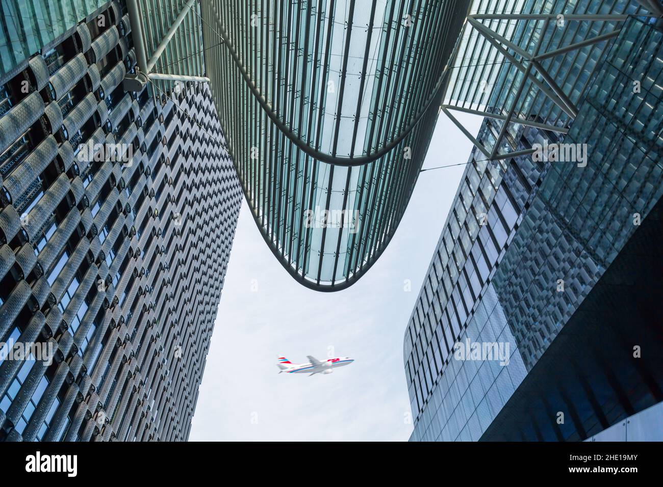 plane flying over the skyscrapers Stock Photo - Alamy