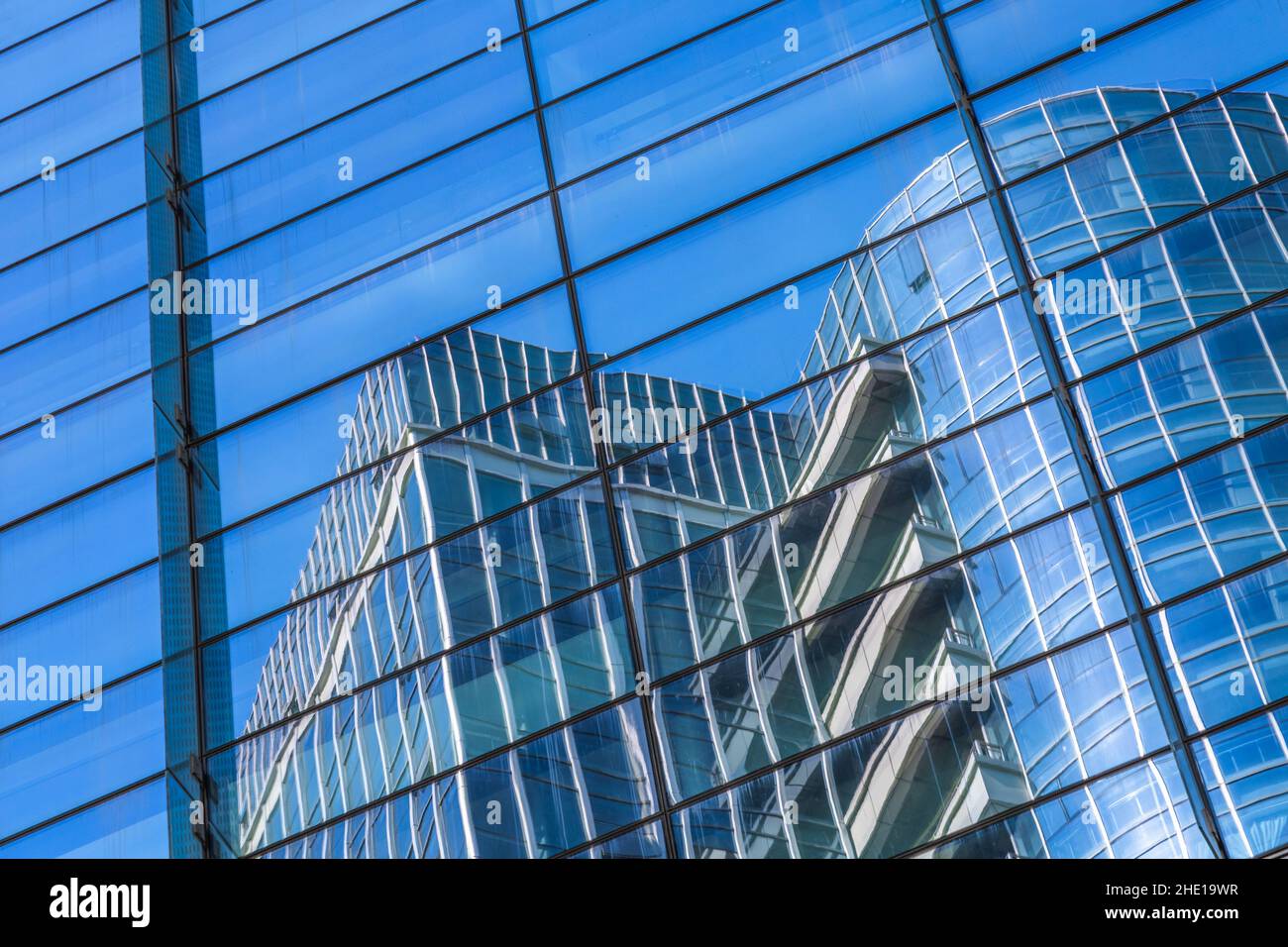Reflection of architecture on modern office building Stock Photo - Alamy