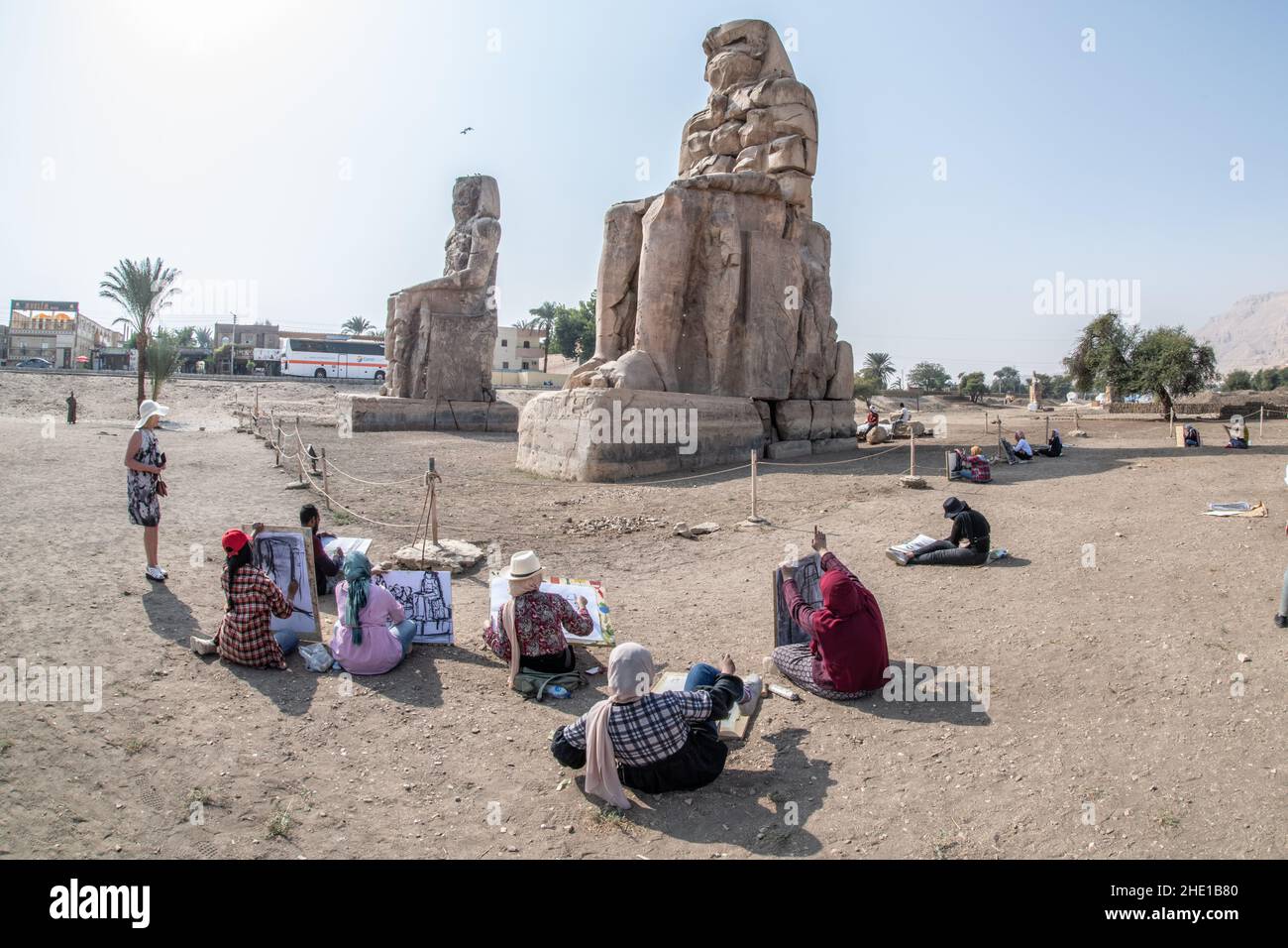 At the Colossi of Memnon historical site, a group of egyptian art ...