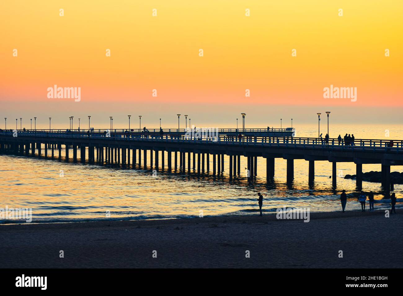 Dramatic colorful sunset at famous marine pier in Baltic resort city of ...
