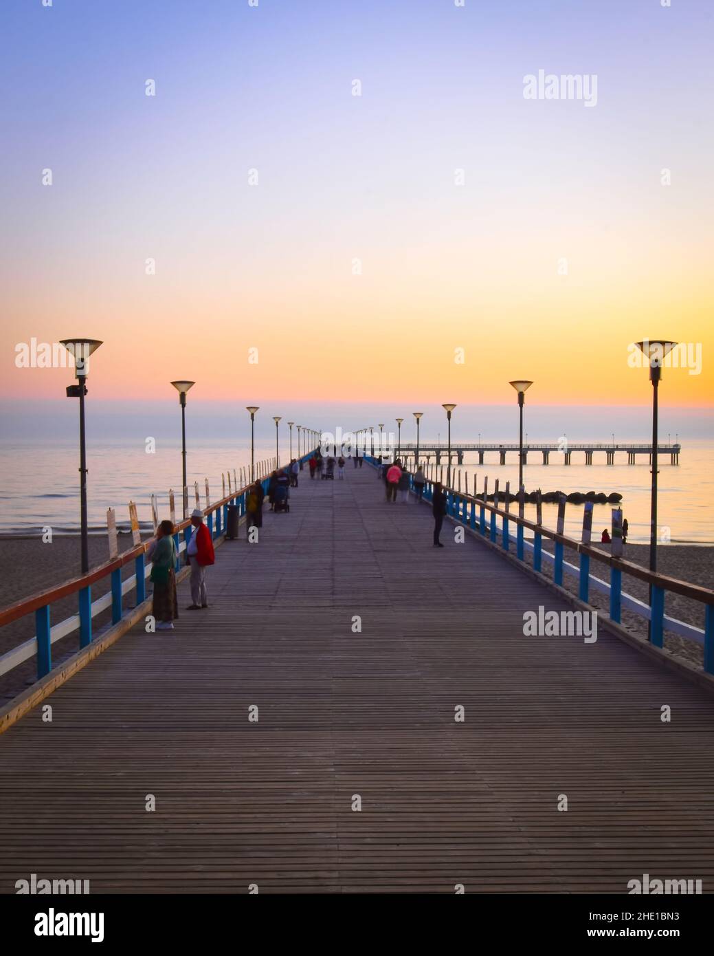 Dramatic colorful sunset at famous marine pier in Baltic resort city of ...