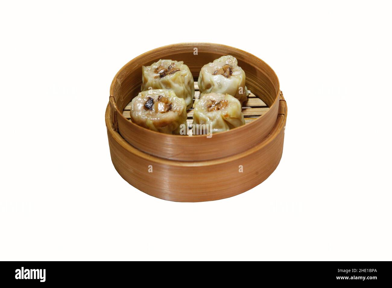 various types of dim sum in a bamboo container on a white background ...