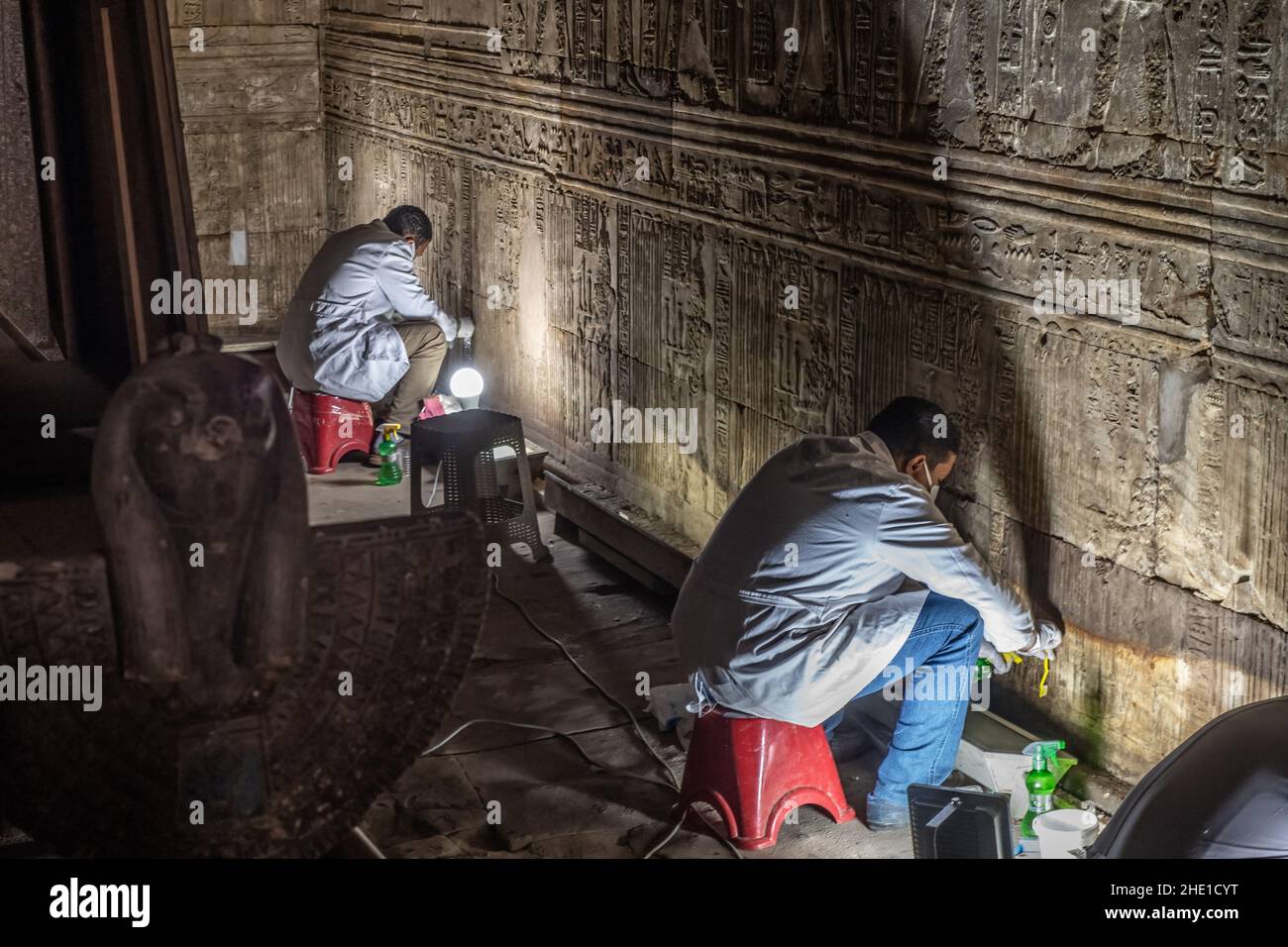 Conservator restorers working to repair and restore ancient egyptian ...