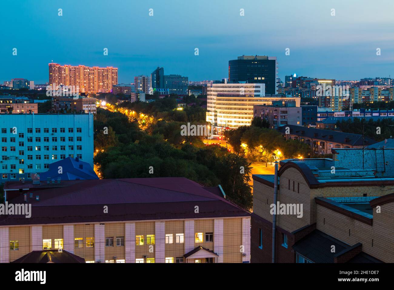 Beautiful aerial view of illuminated buildings and parks of the Tyumen ...