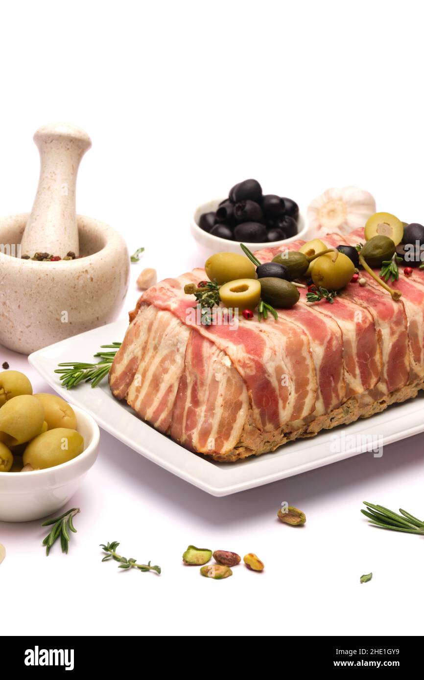 Traditional French terrine covered with bacon isolated on white ...