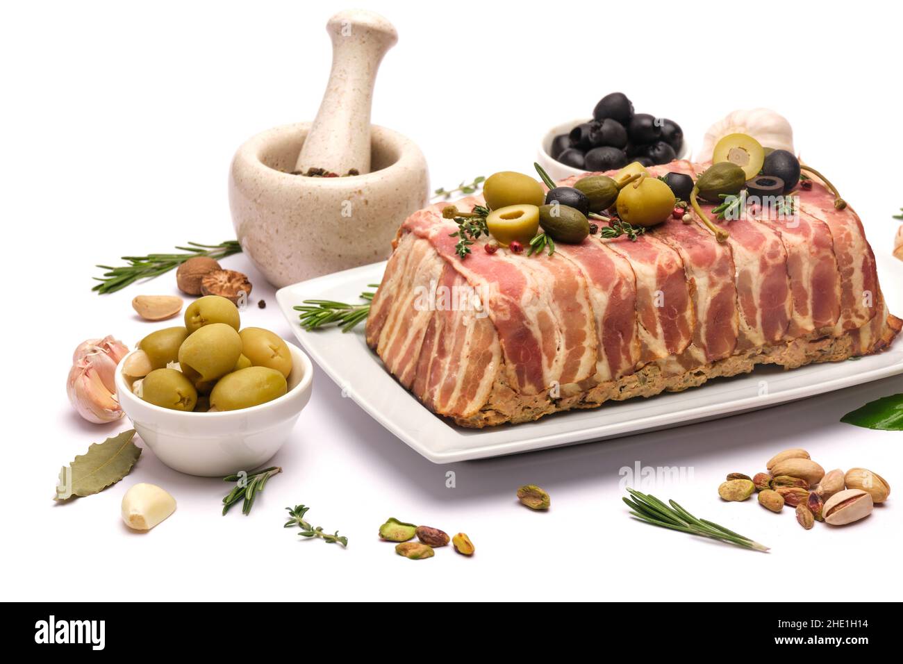 Traditional French terrine covered with bacon isolated on white ...